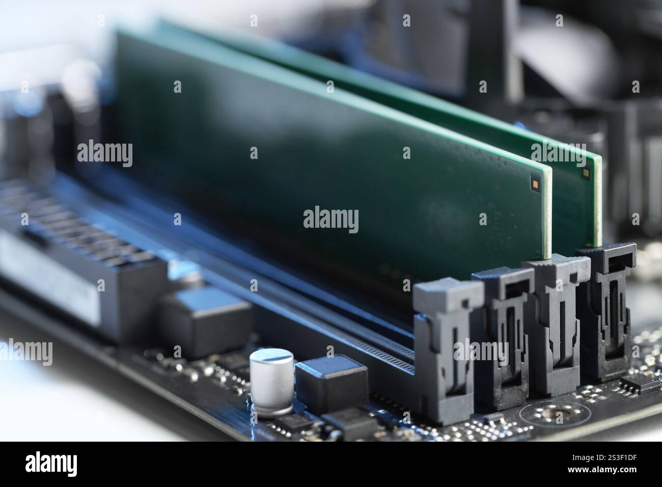 Computer motherboard with RAM chip on table, closeup. Electronic ...