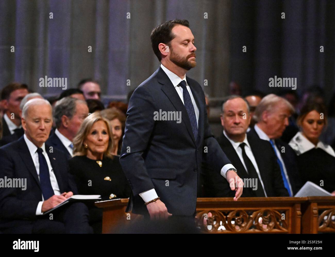 Jason Carter walks to speak during the state funeral for his ...