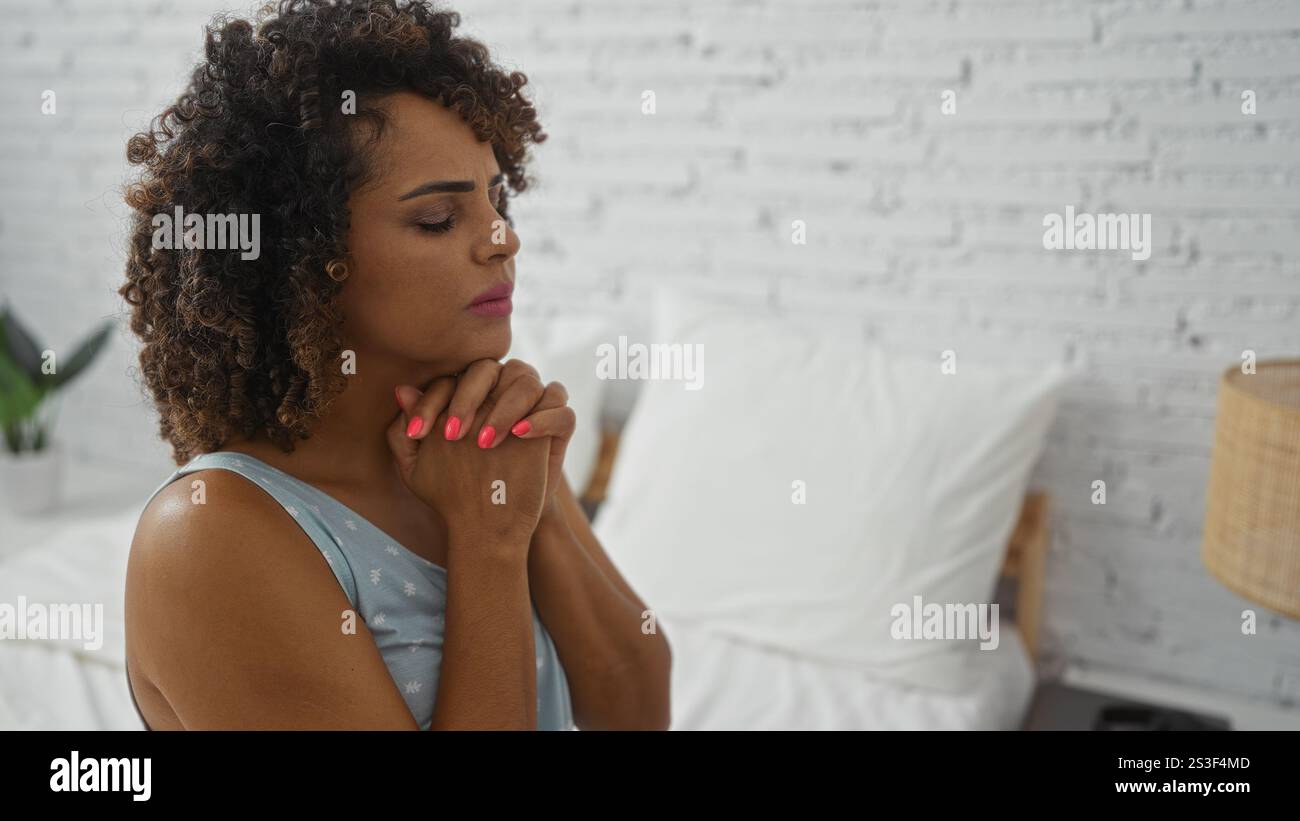Woman praying quietly on hi-res stock photography and images - Alamy