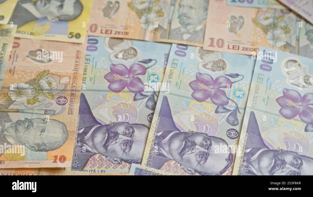 Romanian banknotes, including denominations of 10, 50, and 100 leu, are ...