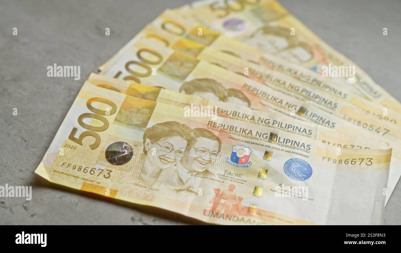 Philippine pesos banknotes on a concrete surface showing close-up ...