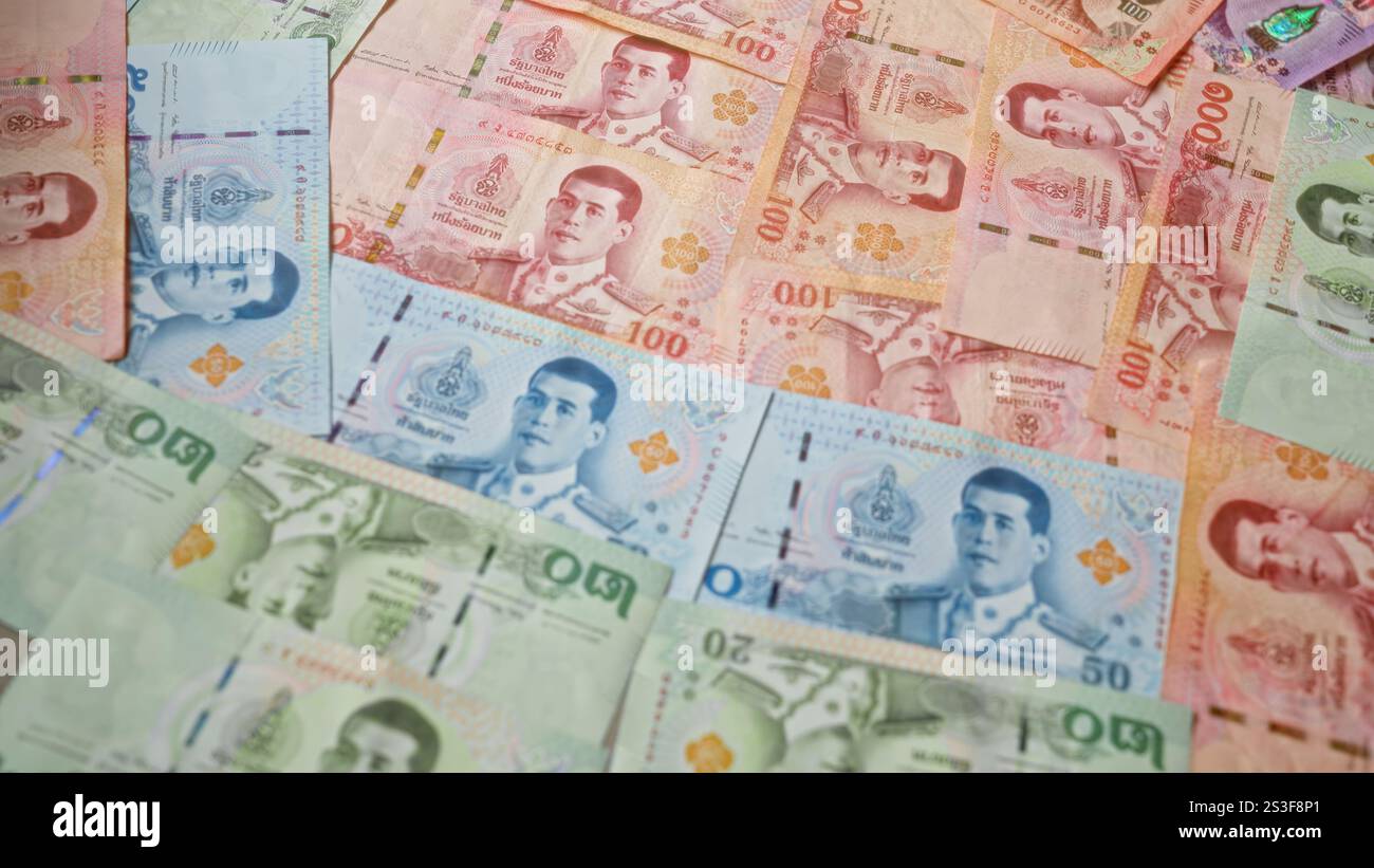 Thai banknotes in various denominations including 20, 50, 100, and 1000 ...
