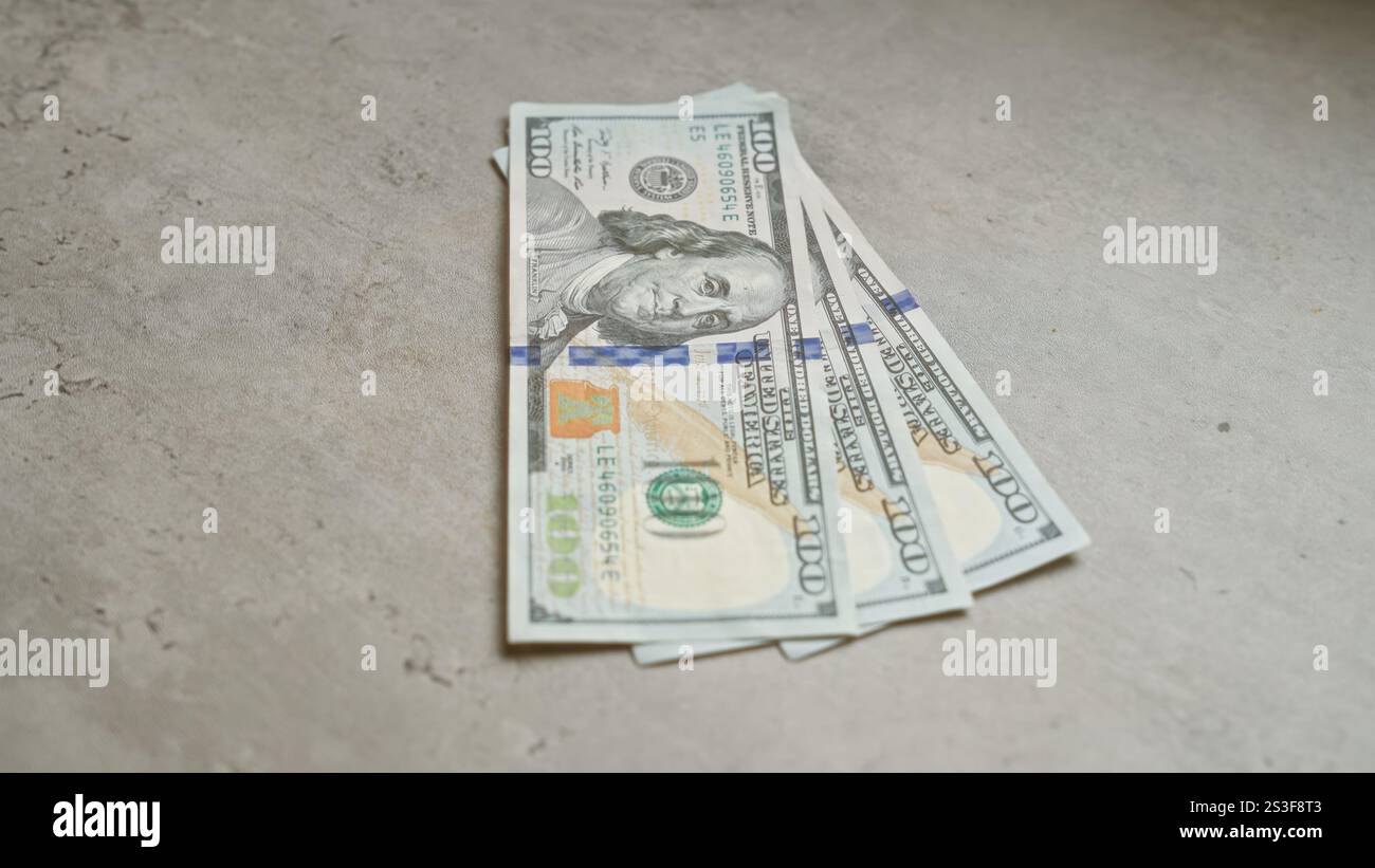 United states dollars on a concrete surface show american currency with ...