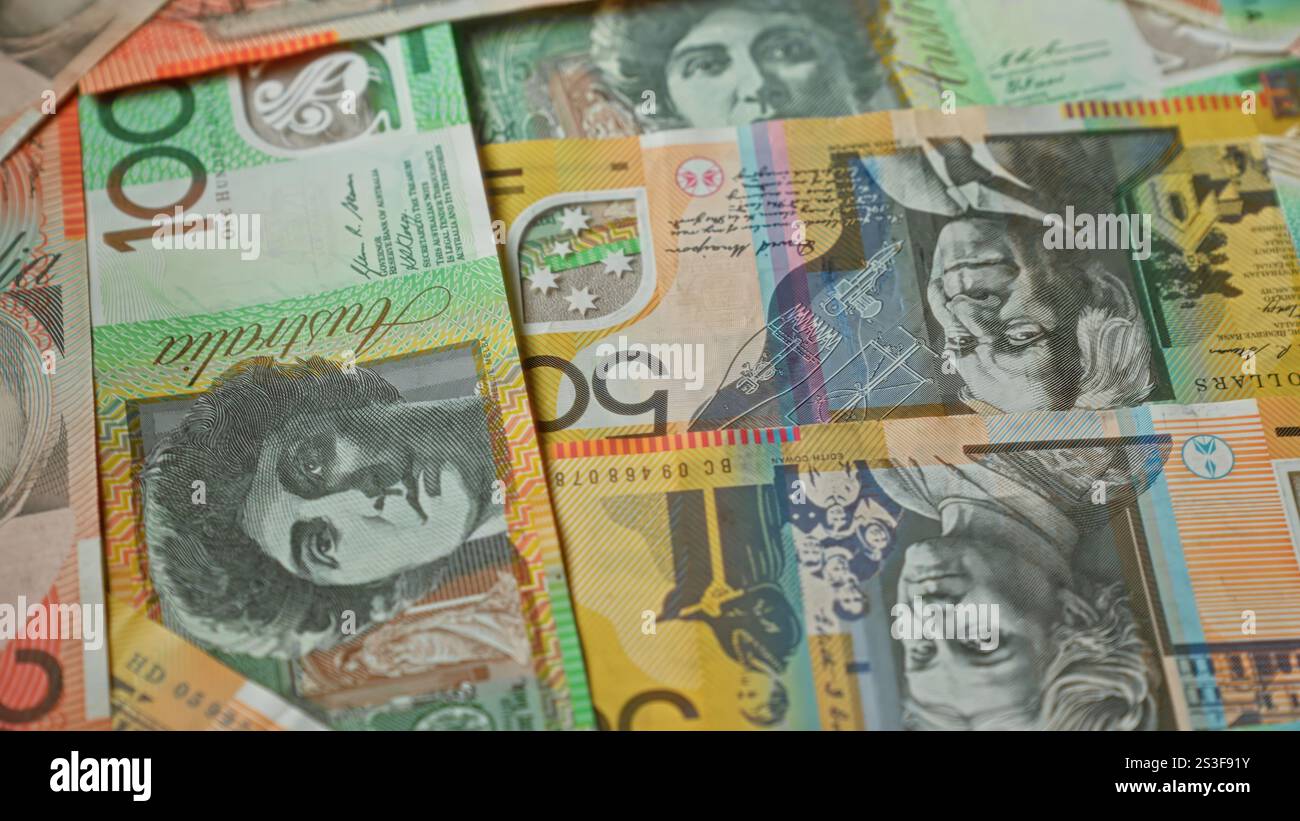Australian banknotes in various denominations scattered on a flat ...