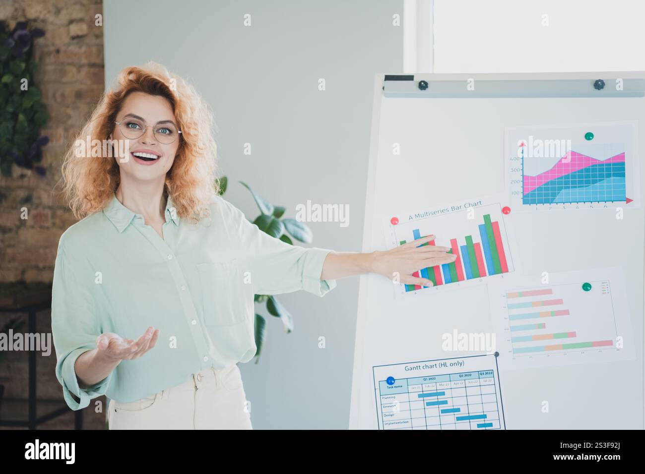 Photo of young corporate lady demonstrate whiteboard presentation ...
