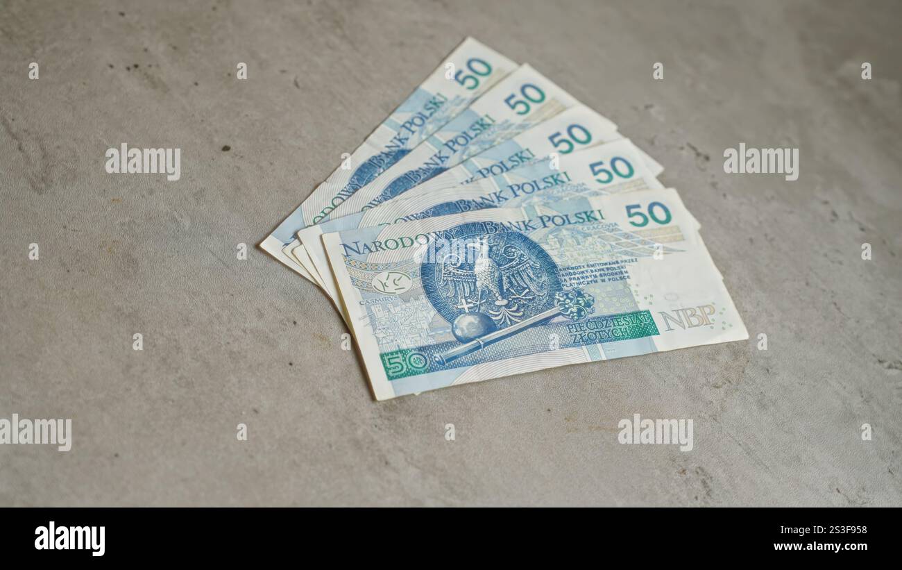 Polish zloty banknotes on a concrete surface displaying currency from ...
