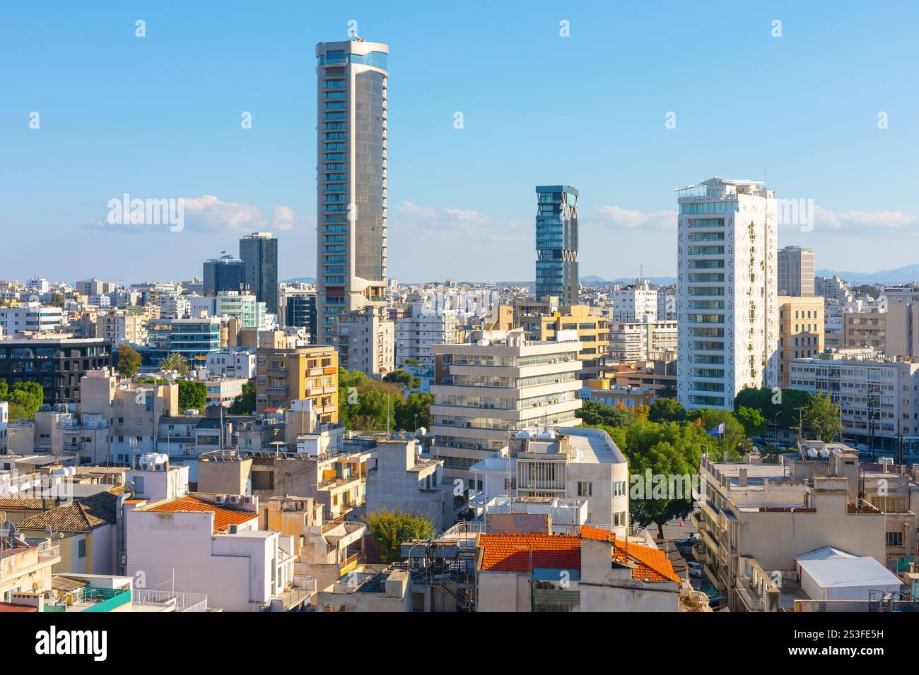 Nicosia cityscape with a mix of modern high-rise buildings and older ...