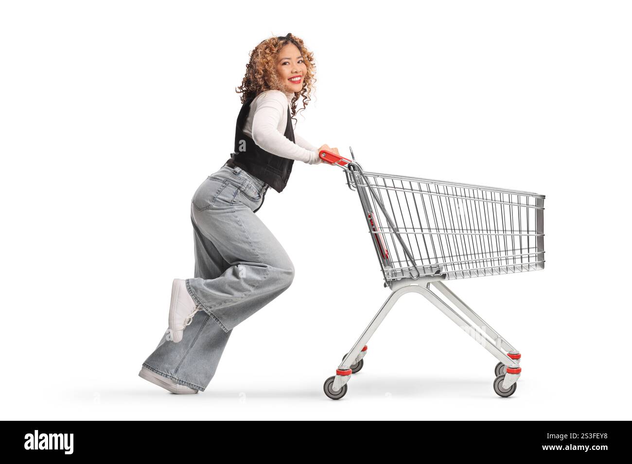 Asian woman running and pushing a shopping cart isolated on white ...