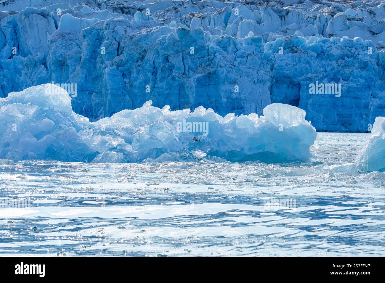 Glacial fragments of ice floating in seawater very close to a glacier ...