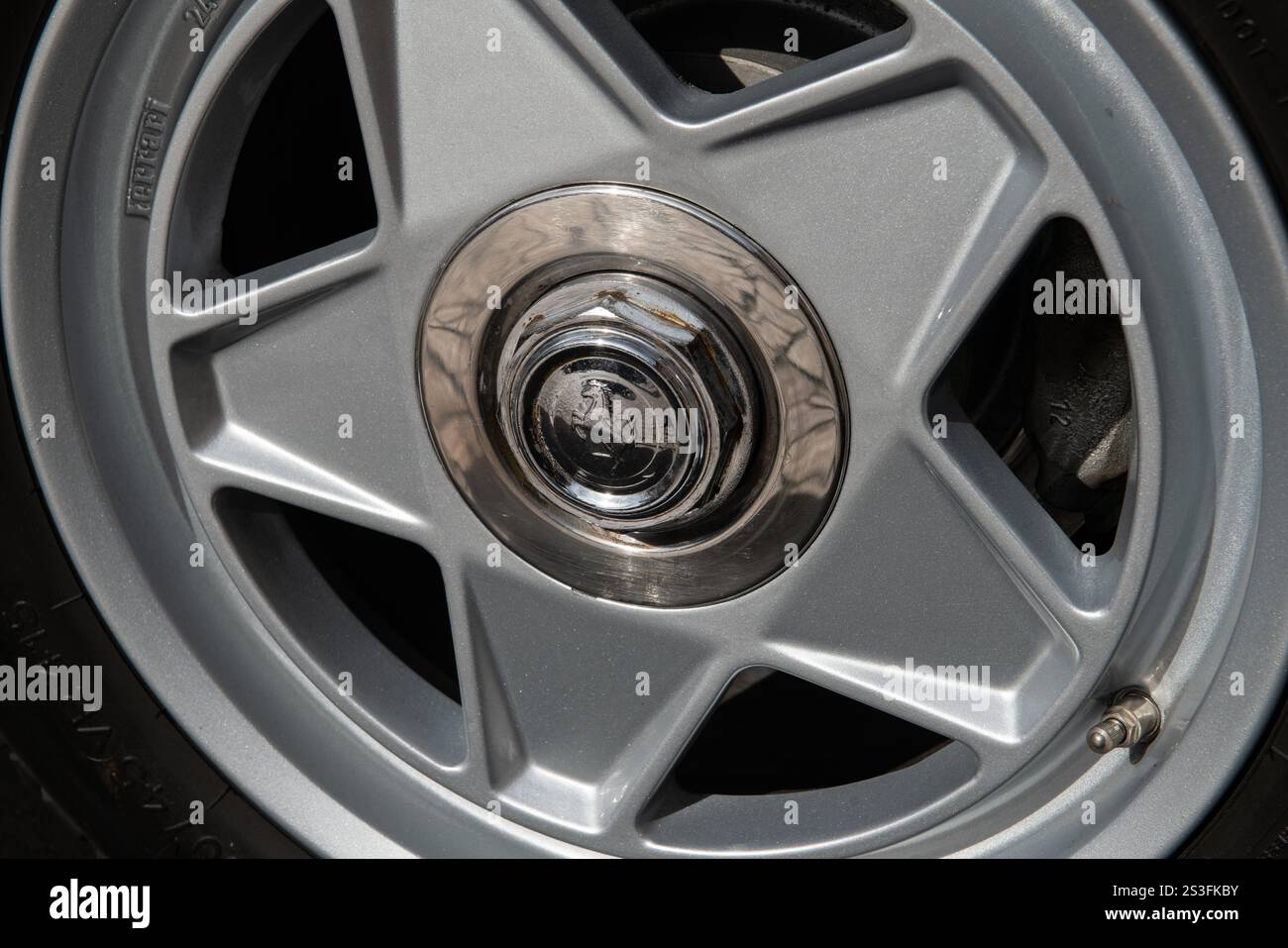 Ferrari, detail of the brand and alloy wheels. Ferrari cars are today ...