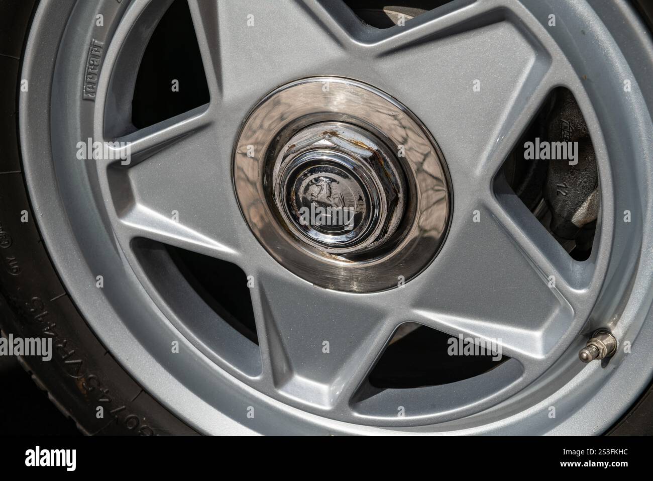 Ferrari, detail of the brand and alloy wheels. Ferrari cars are today ...