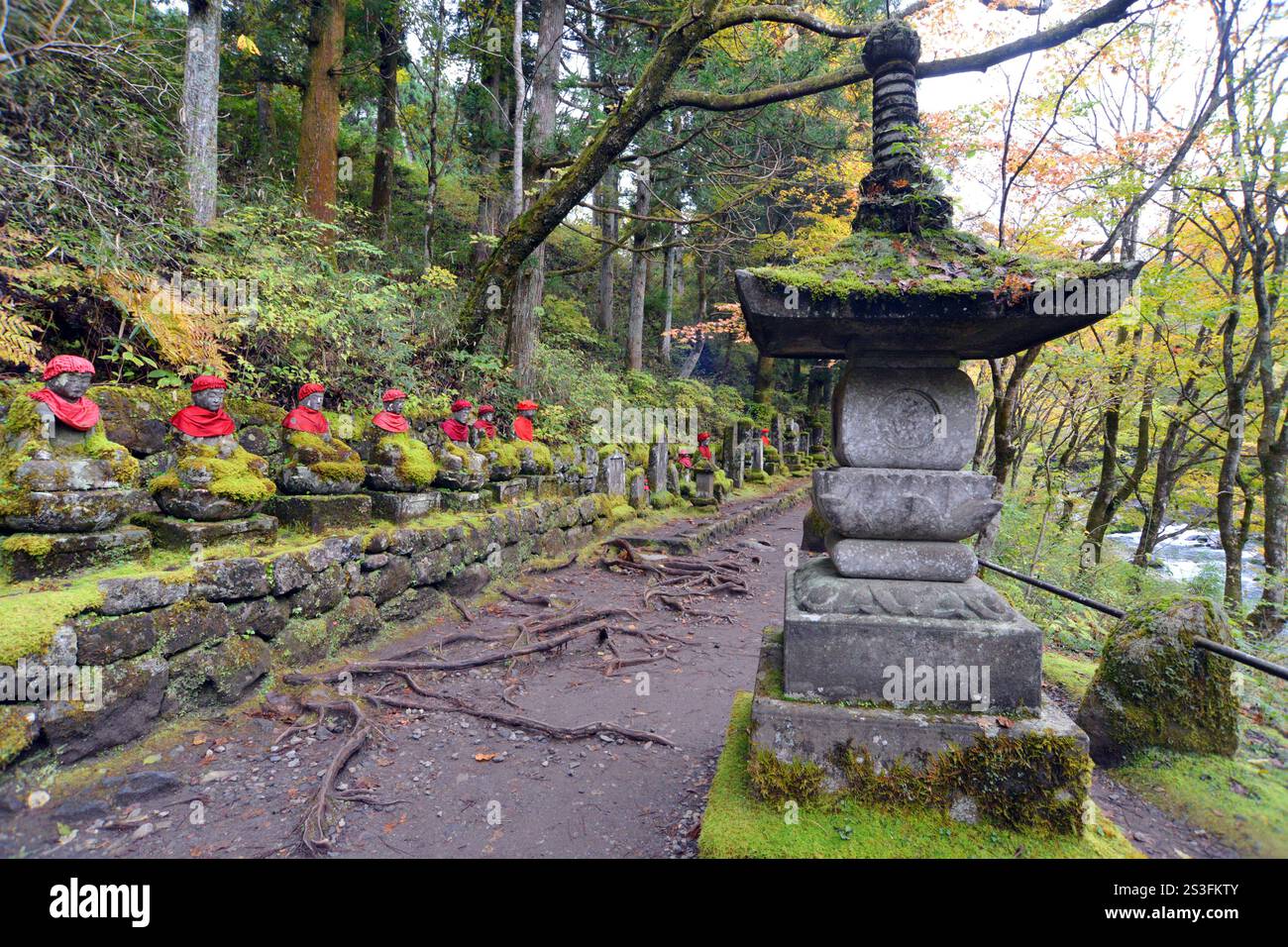 Buddhist statues wear red bibs in Nikko National Park, Japan to protect ...