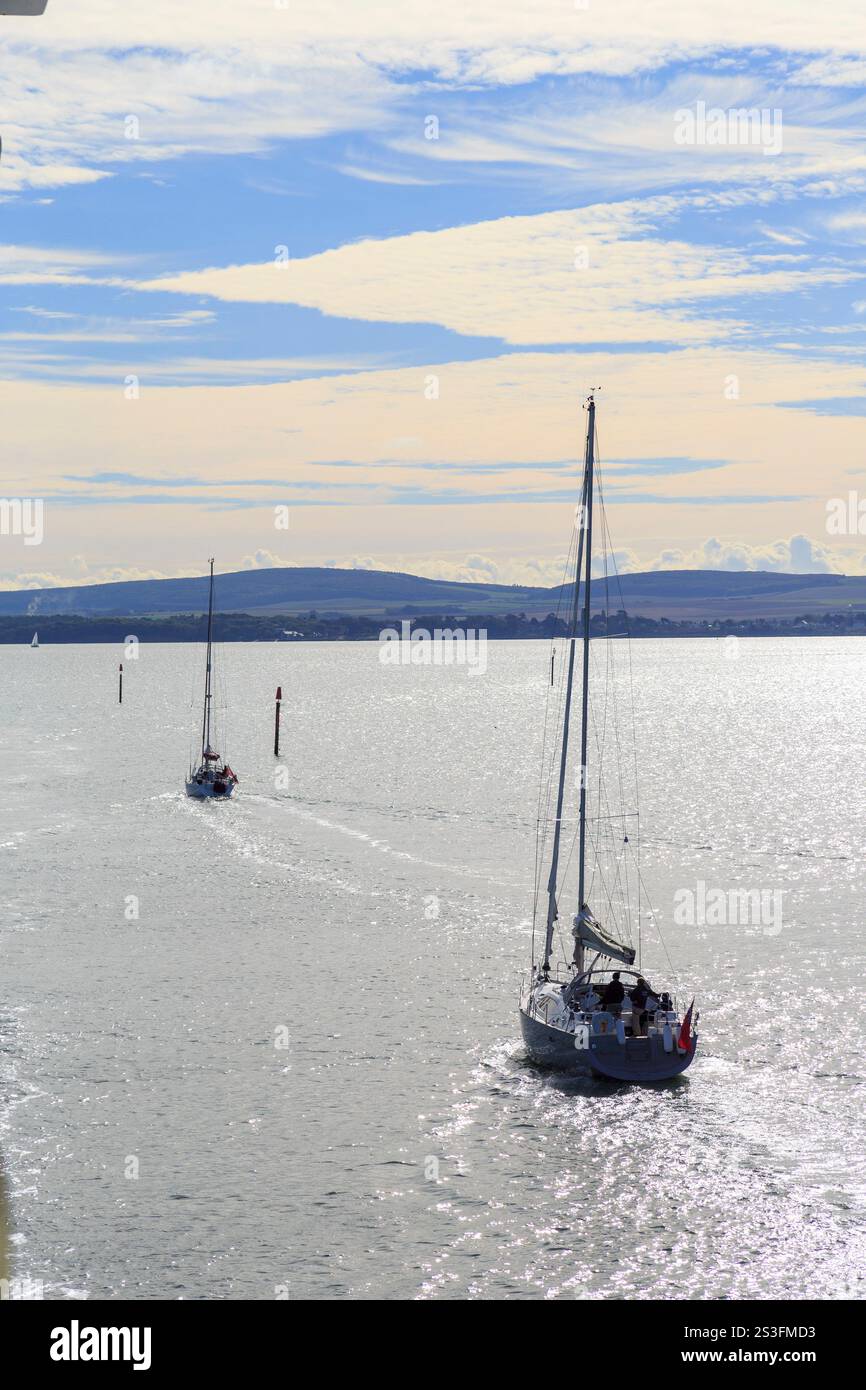 Yachts sailing out of Lymington harbour into The Solent, England, UK ...