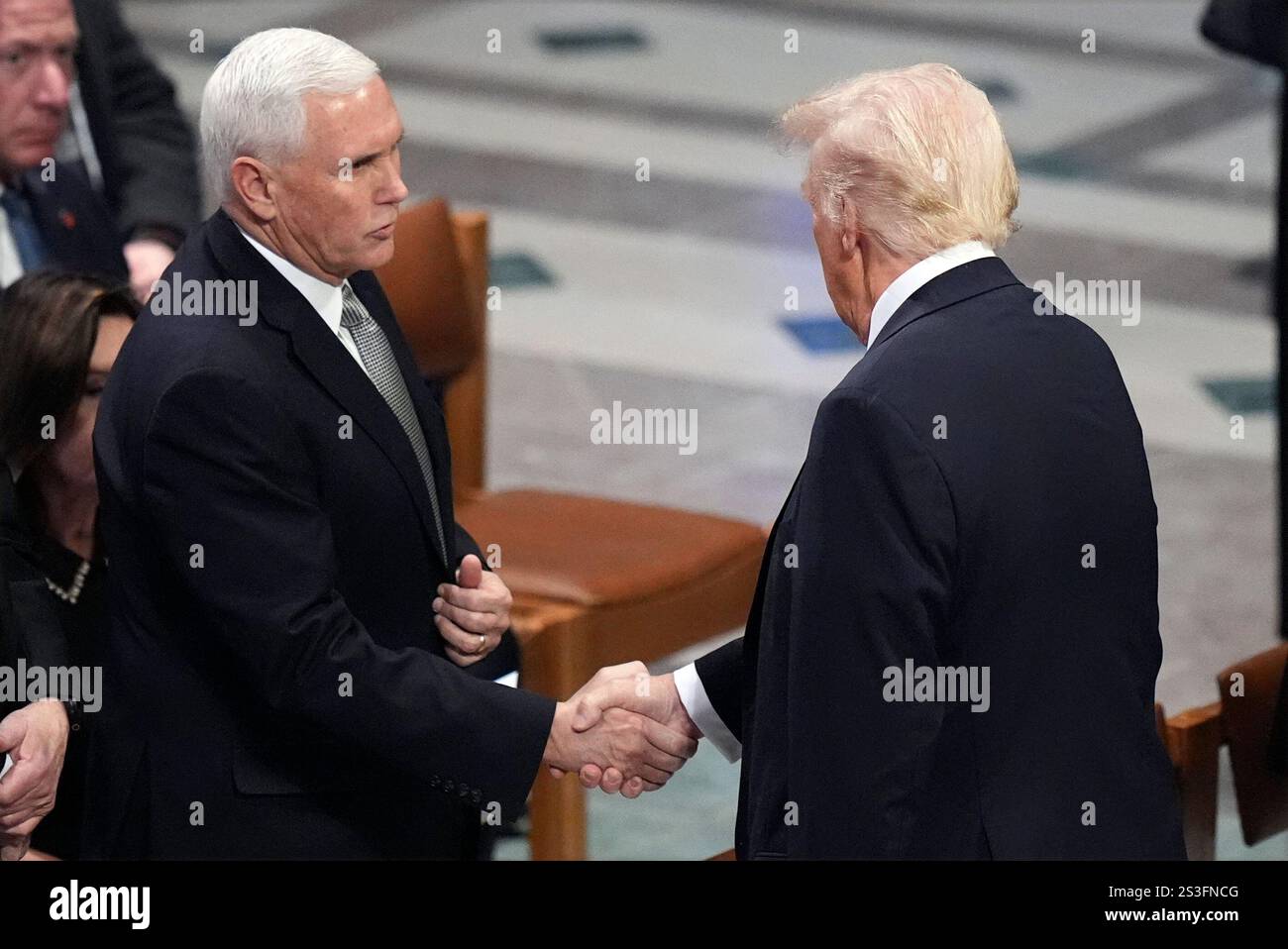 President-elect Donald Trump shakes hands with former Vice President Mike Pence before the state ...
