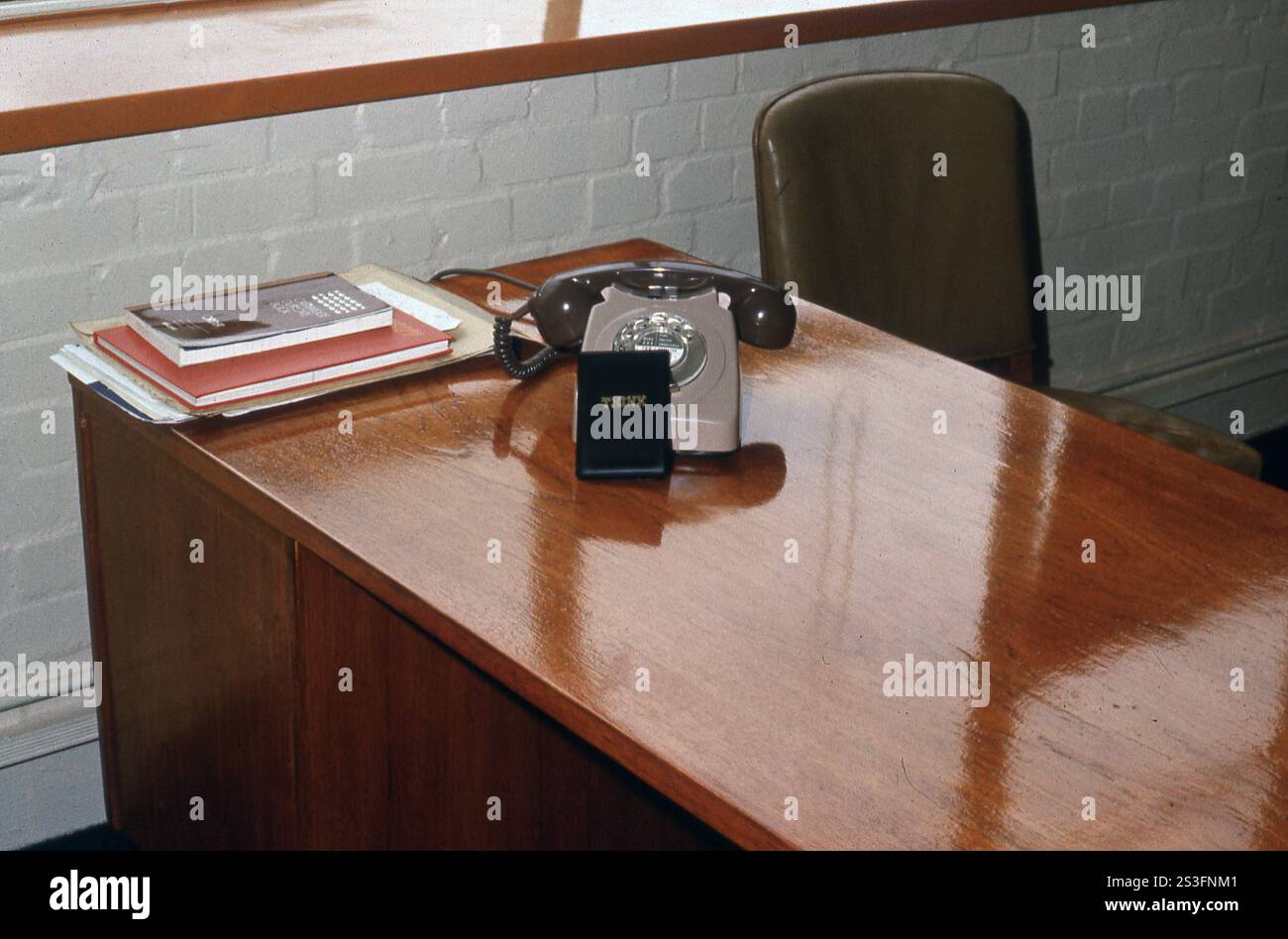 1978, picture shows a shiny wooden desk in an office of a light ...