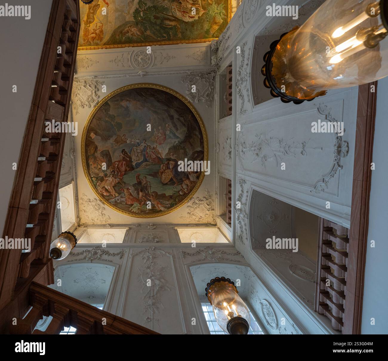 Magnificent staircase with impressive intricate stucco paintings and ceiling frescoes in the ...