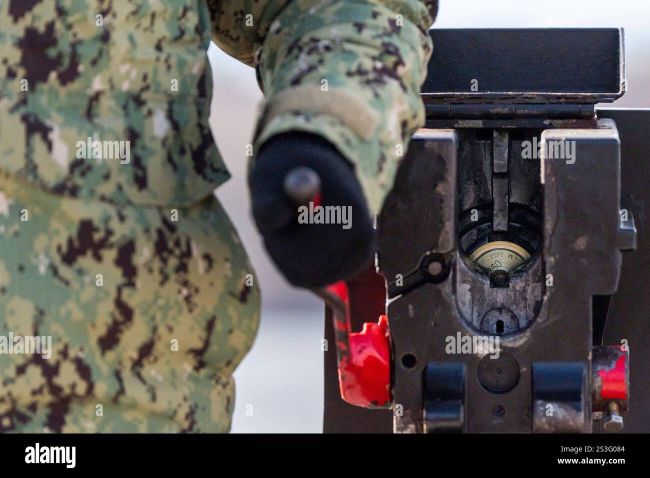 Chief Michael Marshalsea fires a 40mm saluting battery during a 21-gun ...
