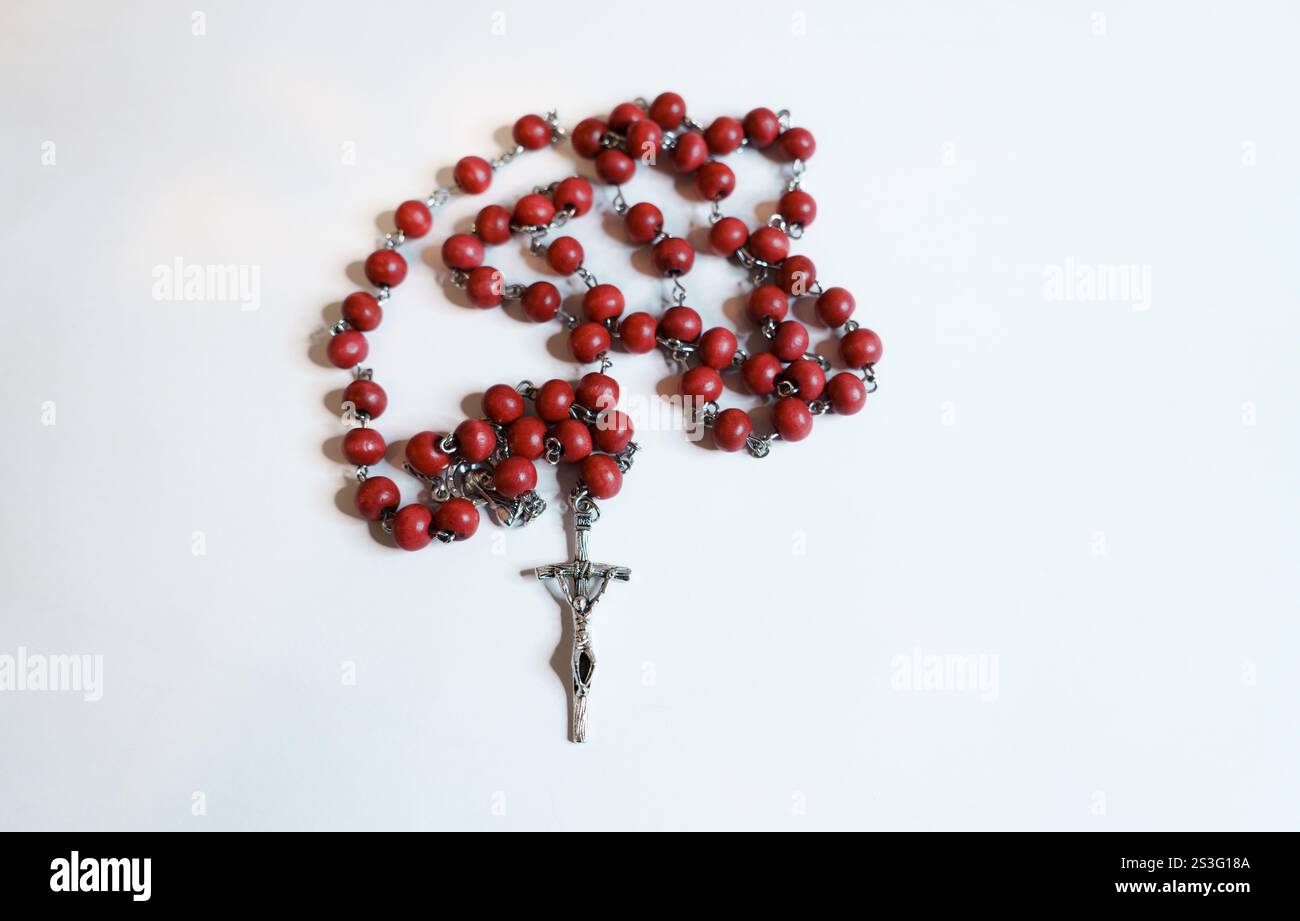 Red rosary on plain background Stock Photo - Alamy