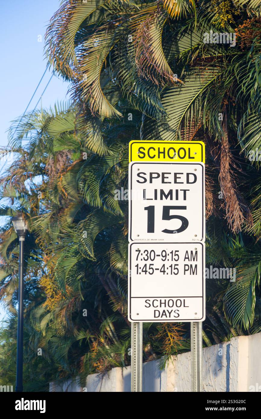 speed limit 15 on school days at a traffic sign in Miami, USA Stock ...