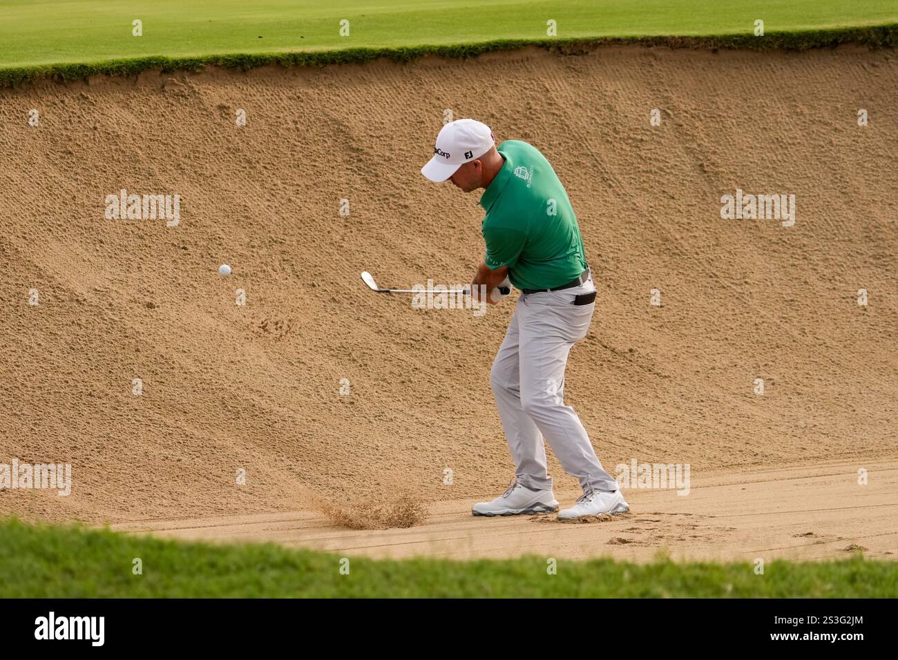 Brian Harman hits out of a bunker on the 15th hole during the first ...