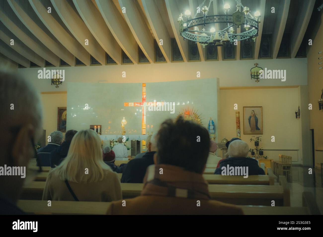 Interior view of a Catholic church during a service. The congregation ...