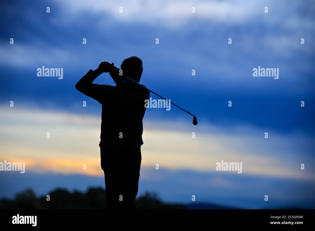 Anonymous golfers hitting balls Stock Photo - Alamy