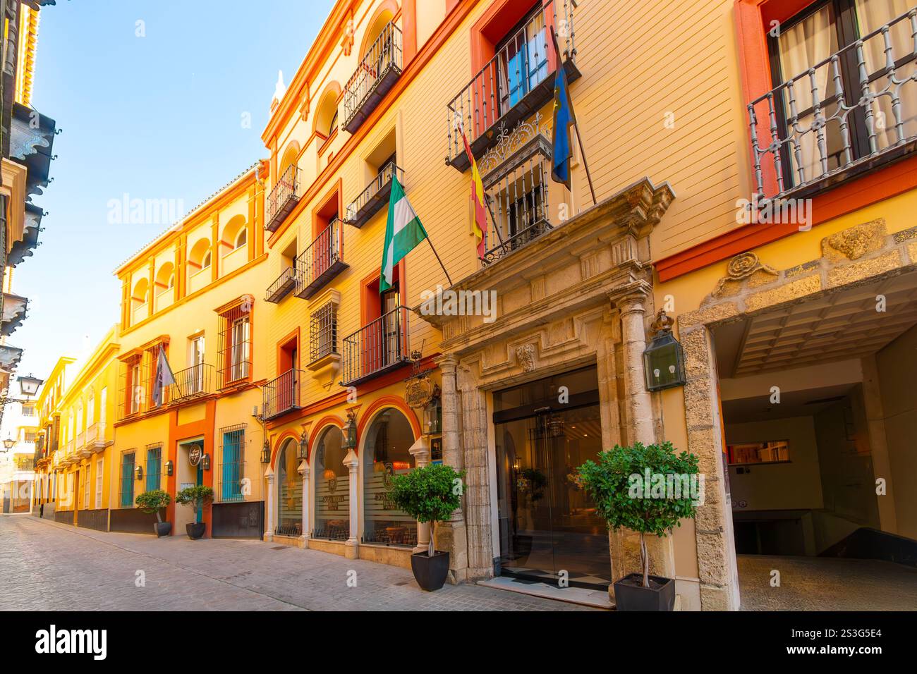 Colorful Andalusian buildings in the historic central Barrio Santa Cruz ...