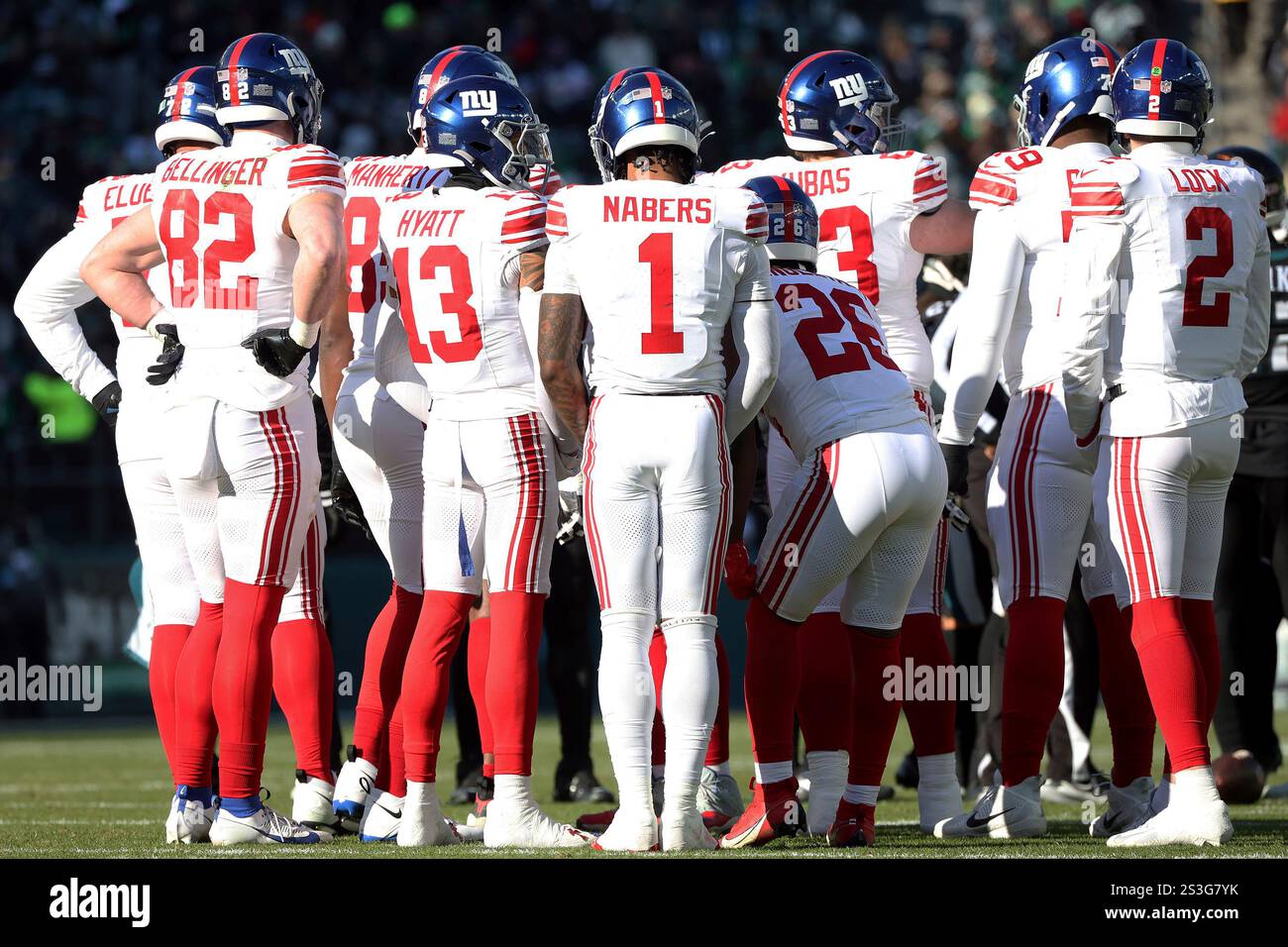 New York Giants players huddle up during an NFL football game against ...