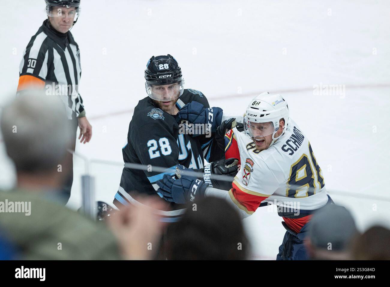 Utah Hockey Club fans film the fight against the Florida Panthers ...