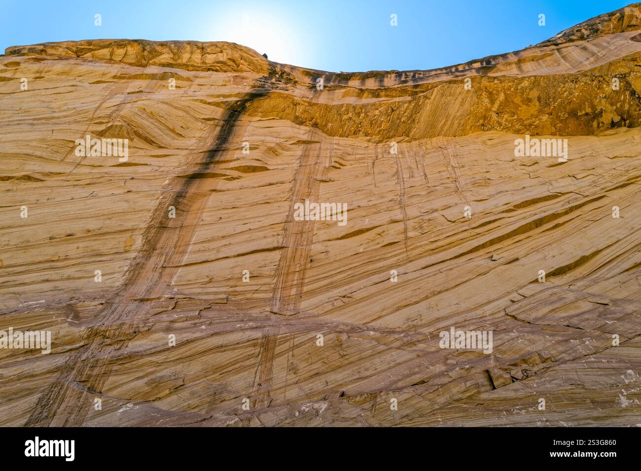 Upward view of a steep sandstone canyon wall at Capitol Reef National ...