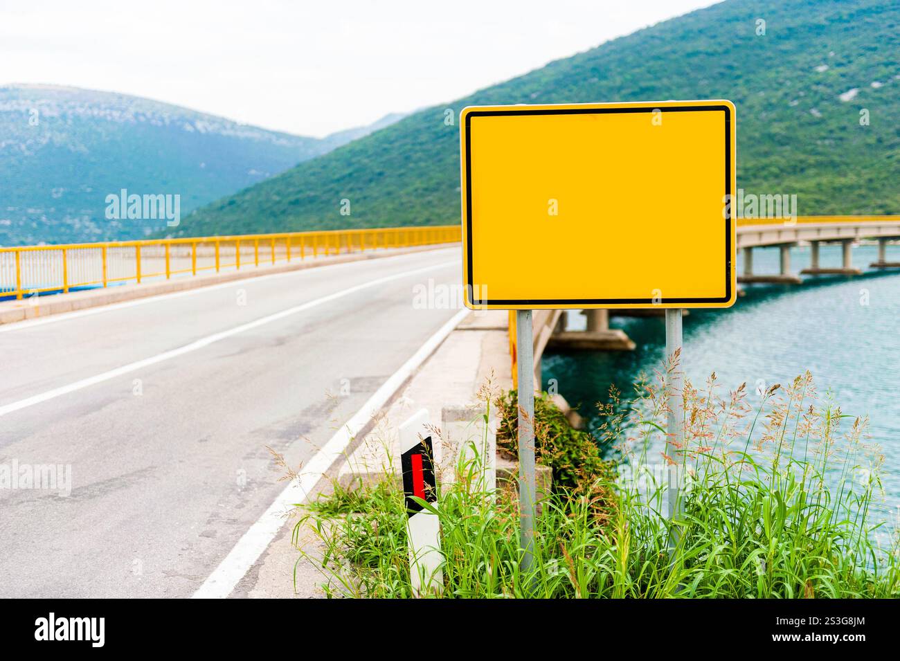Empty road sign before the bridge Stock Photo - Alamy