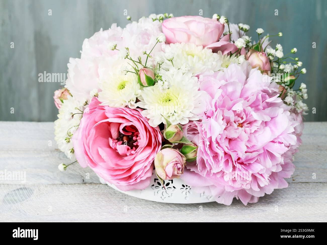 Floral arrangement with pink peonies, tiny roses, chrysanthemums and ...