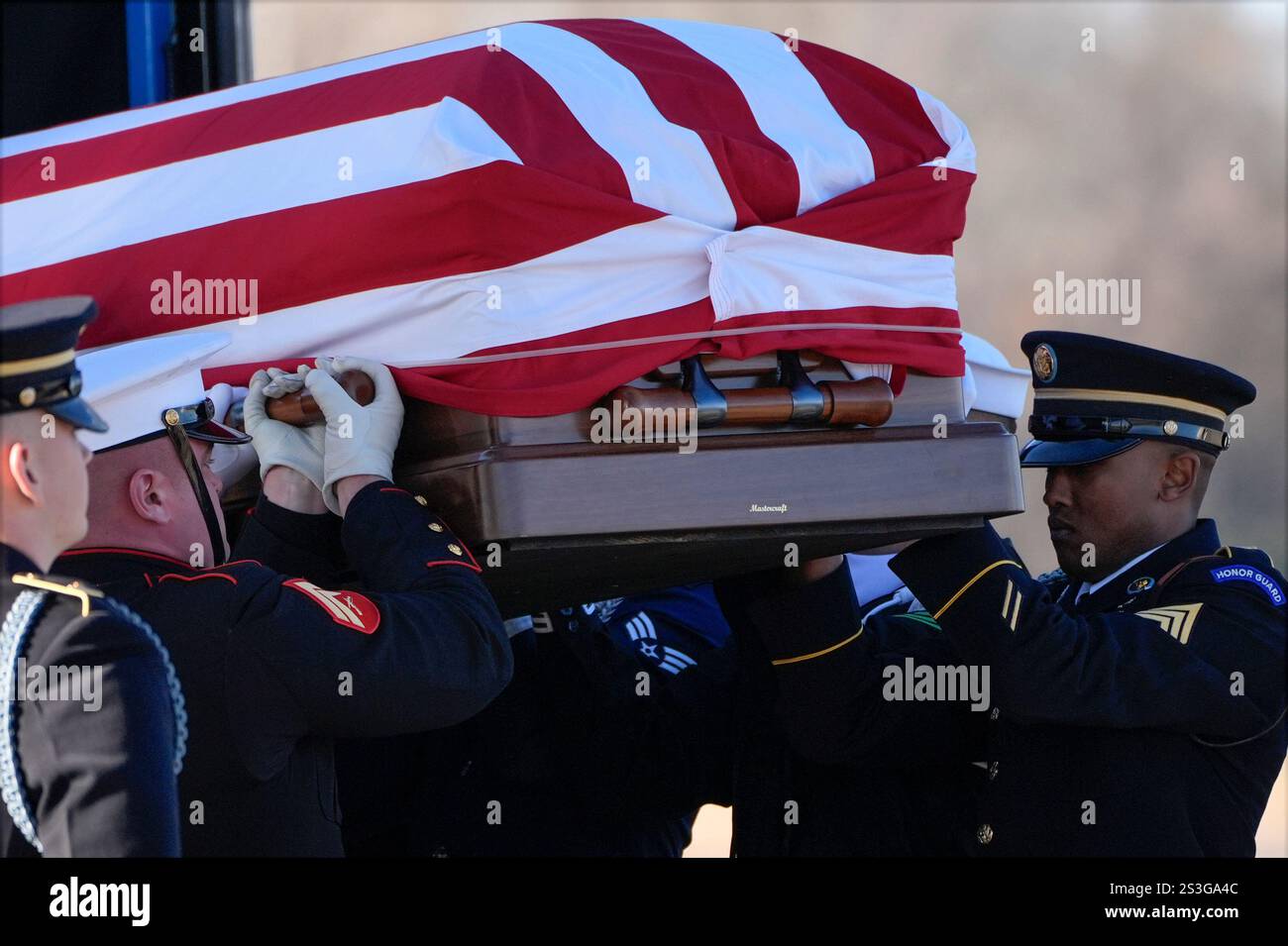 Member of the joint services body geared team move the casket of former ...