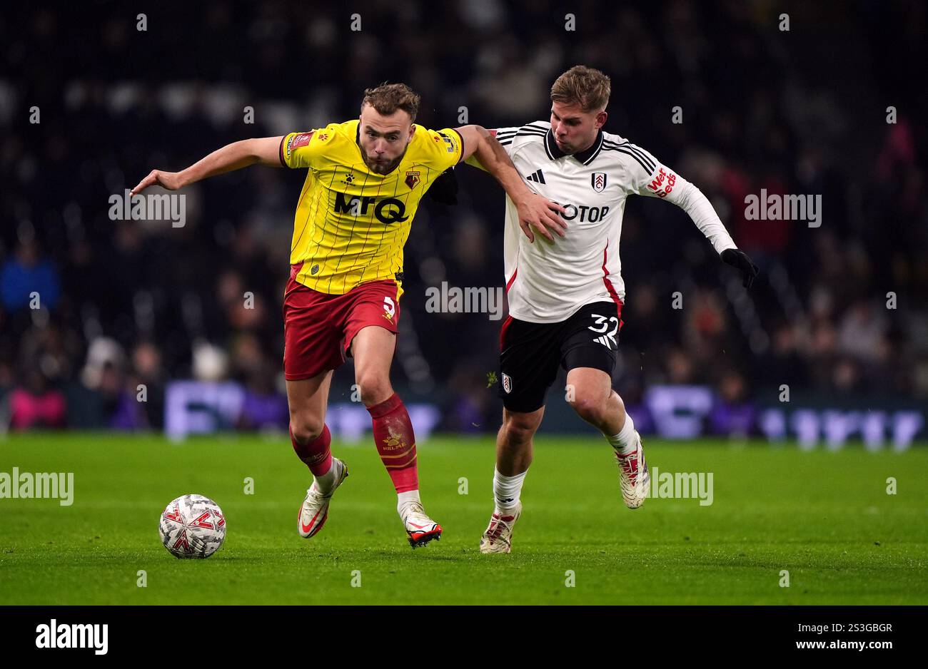 Watford's Ryan Porteous and Fulham's Emile Smith Rowe (right) battle ...