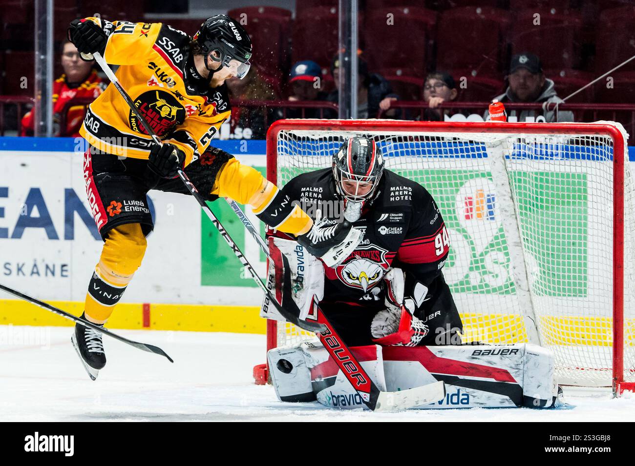 250109 Luleås Brendan Shinnimin och Malmö Redhawks målvakt Marek Langhamer under ishockeymatchen ...