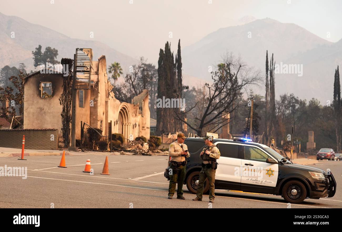 Los Angeles County Sheriff's deputies stand near the destroyed Altadena ...