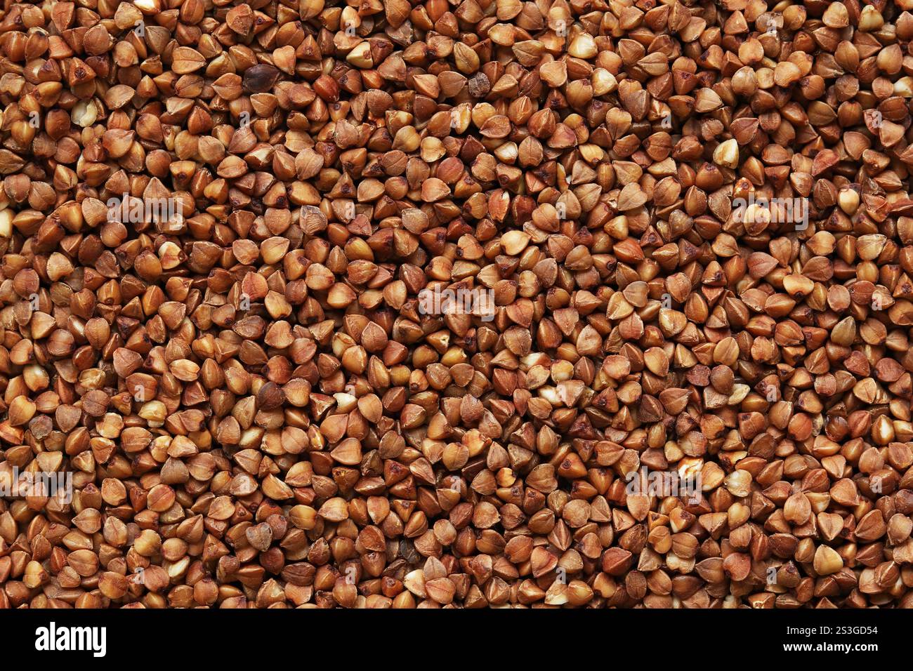 Buckwheat groats, top view. Raw large buckwheat grains, uncooked ...