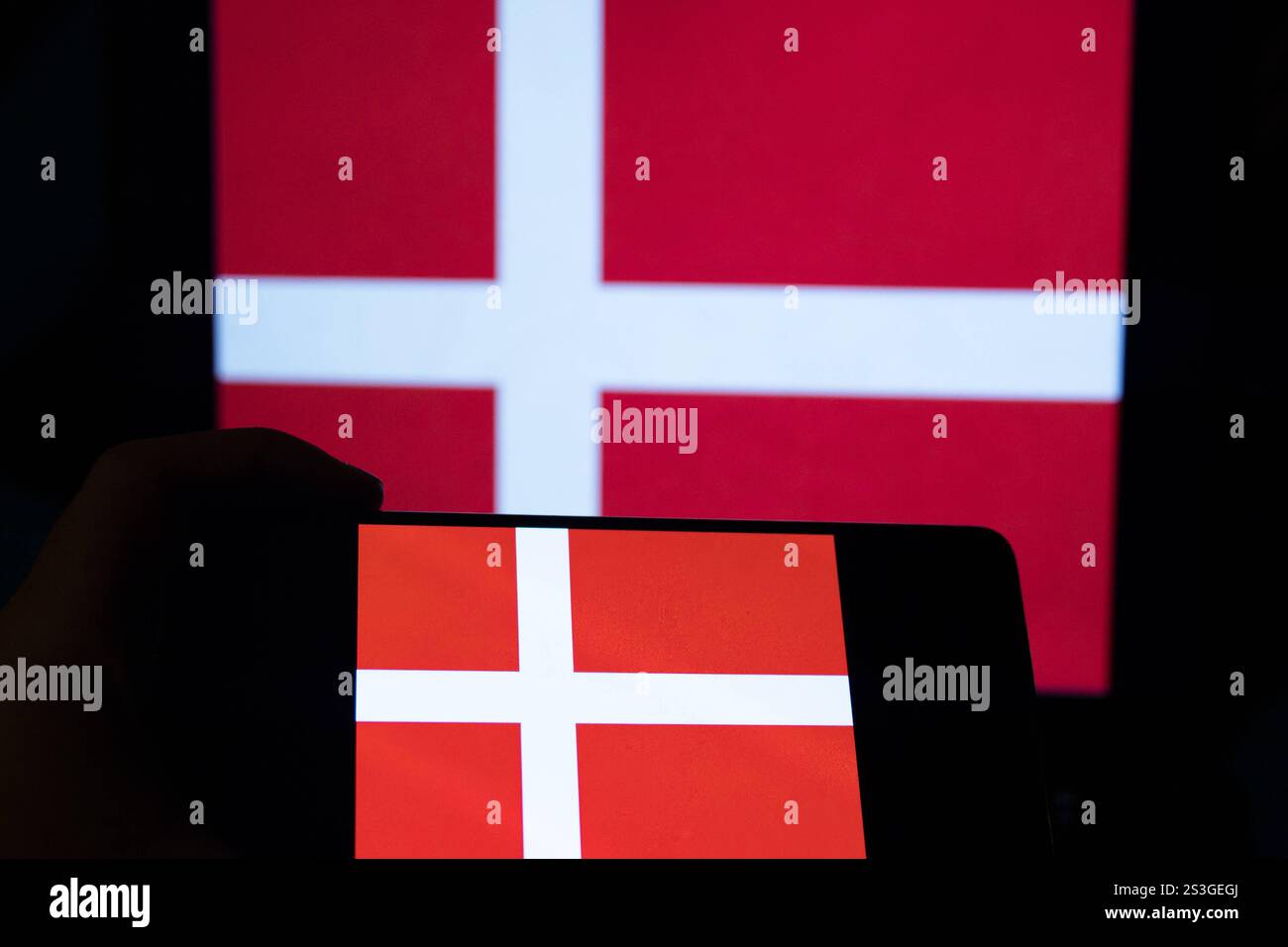 In this photo illustration, the flag of Denmark is seen displayed on a ...