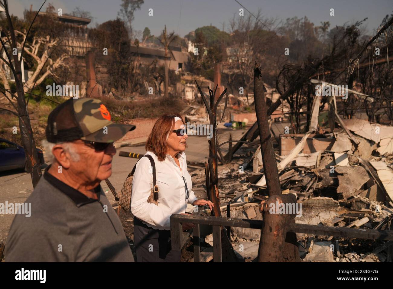 Ali Habibi and his wife Shabnam visit their fire-ravaged home in the ...