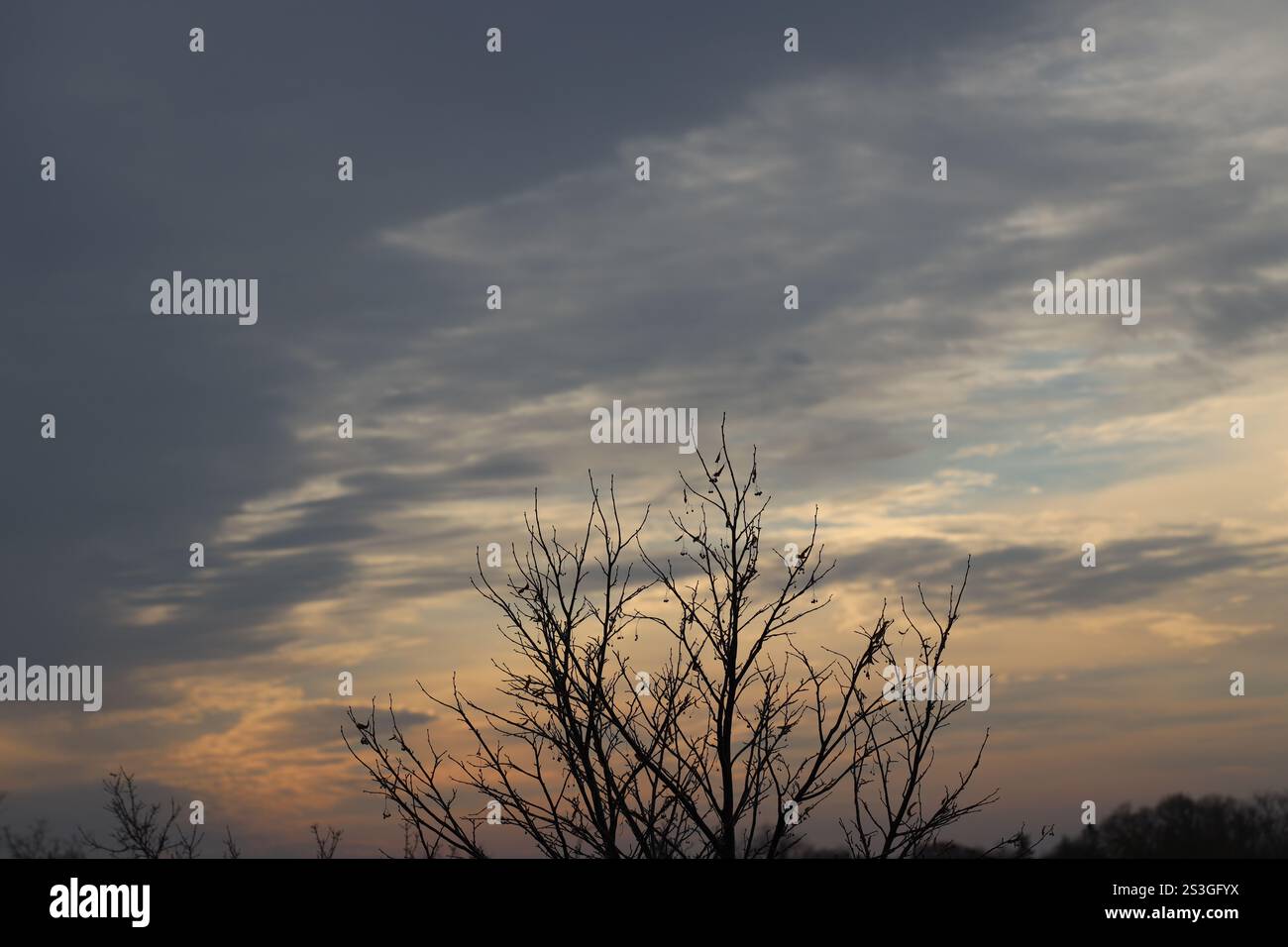 dark gray storm clouds encroaching on blue skies Stock Photo - Alamy