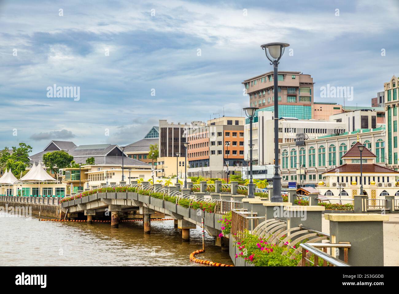 Brunei river banks with bridge and decorated promenade city street and ...