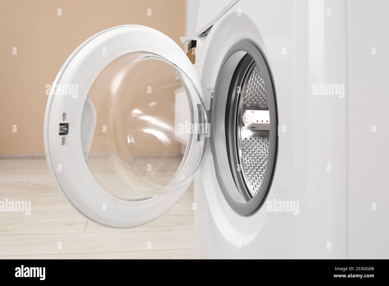 Washing machine with empty drum indoors, closeup Stock Photo - Alamy