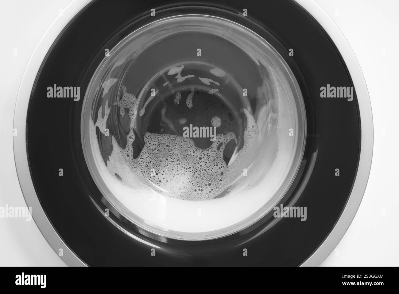 Washing machine with suds as background, closeup Stock Photo - Alamy