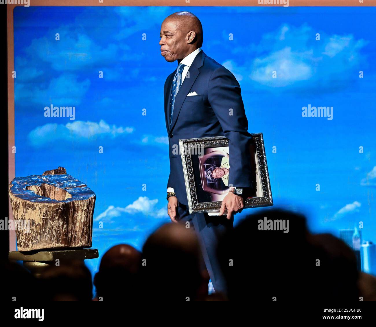 New York, USA. 09th Jan, 2025. Mayor Eric Adams carries the portrait of ...