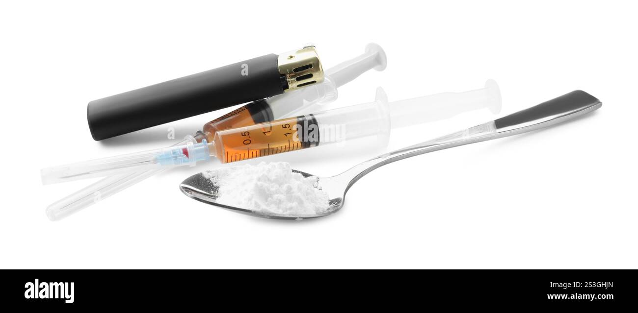 Drug addiction. Spoon with powder, cigarette lighter and syringes ...