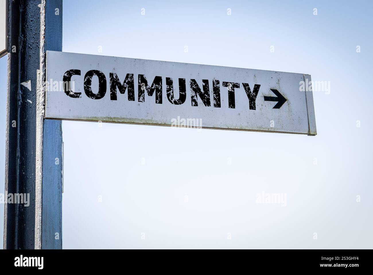 Community. Road sign arrow with text. Outdoor Stock Photo - Alamy