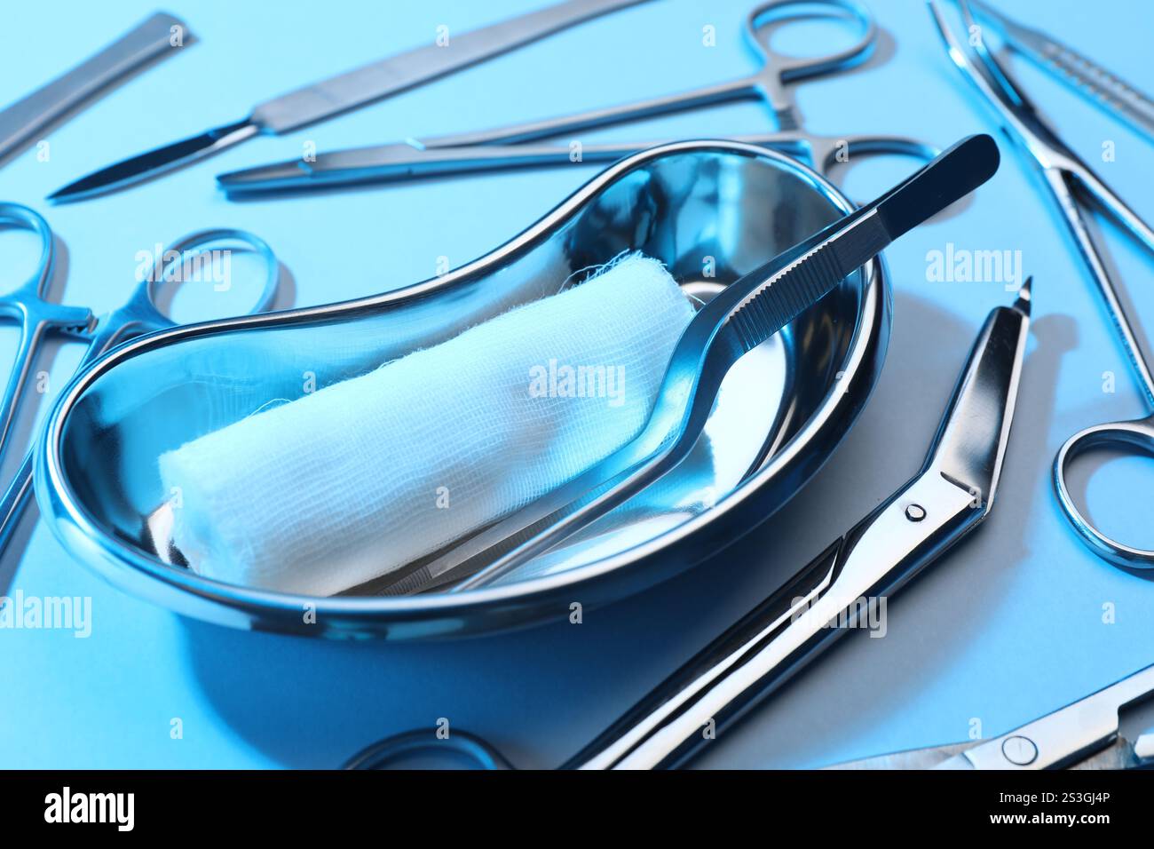 Different surgical instruments on light blue background, closeup Stock ...
