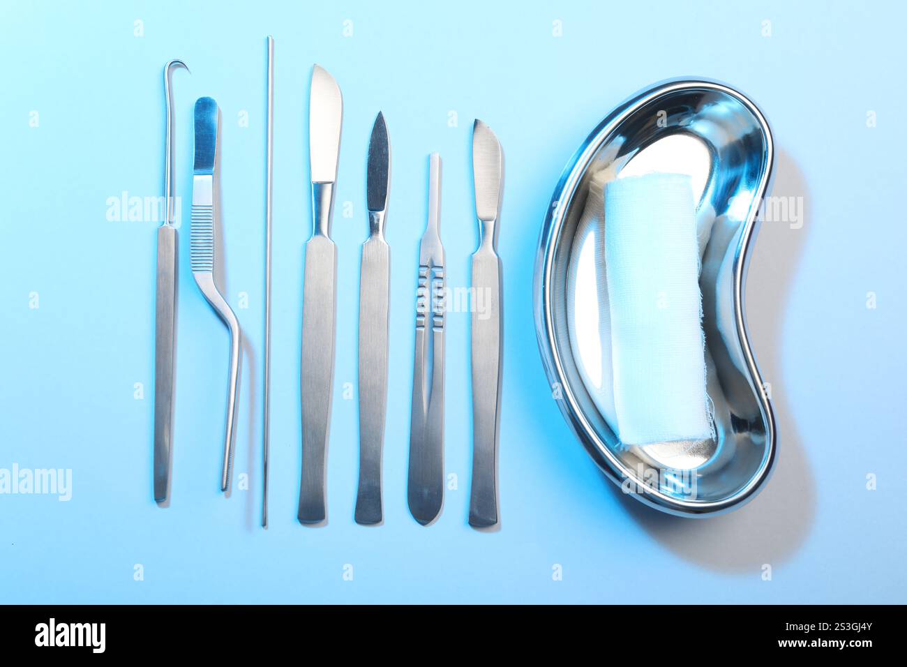 Different surgical instruments on light blue background, flat lay Stock ...