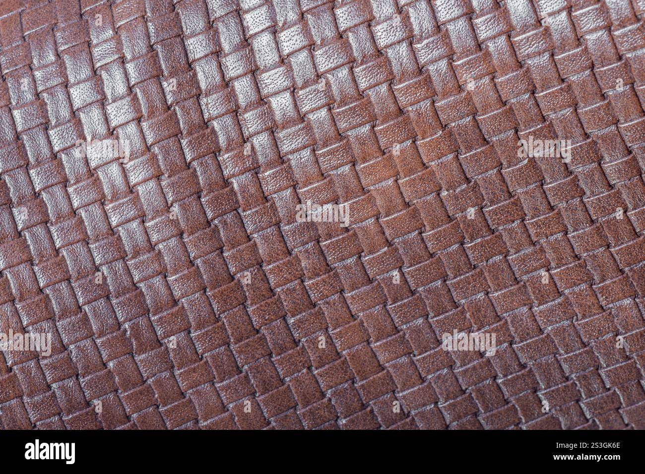 Chocolate brown color leather with interlacing pattern creating squares ...