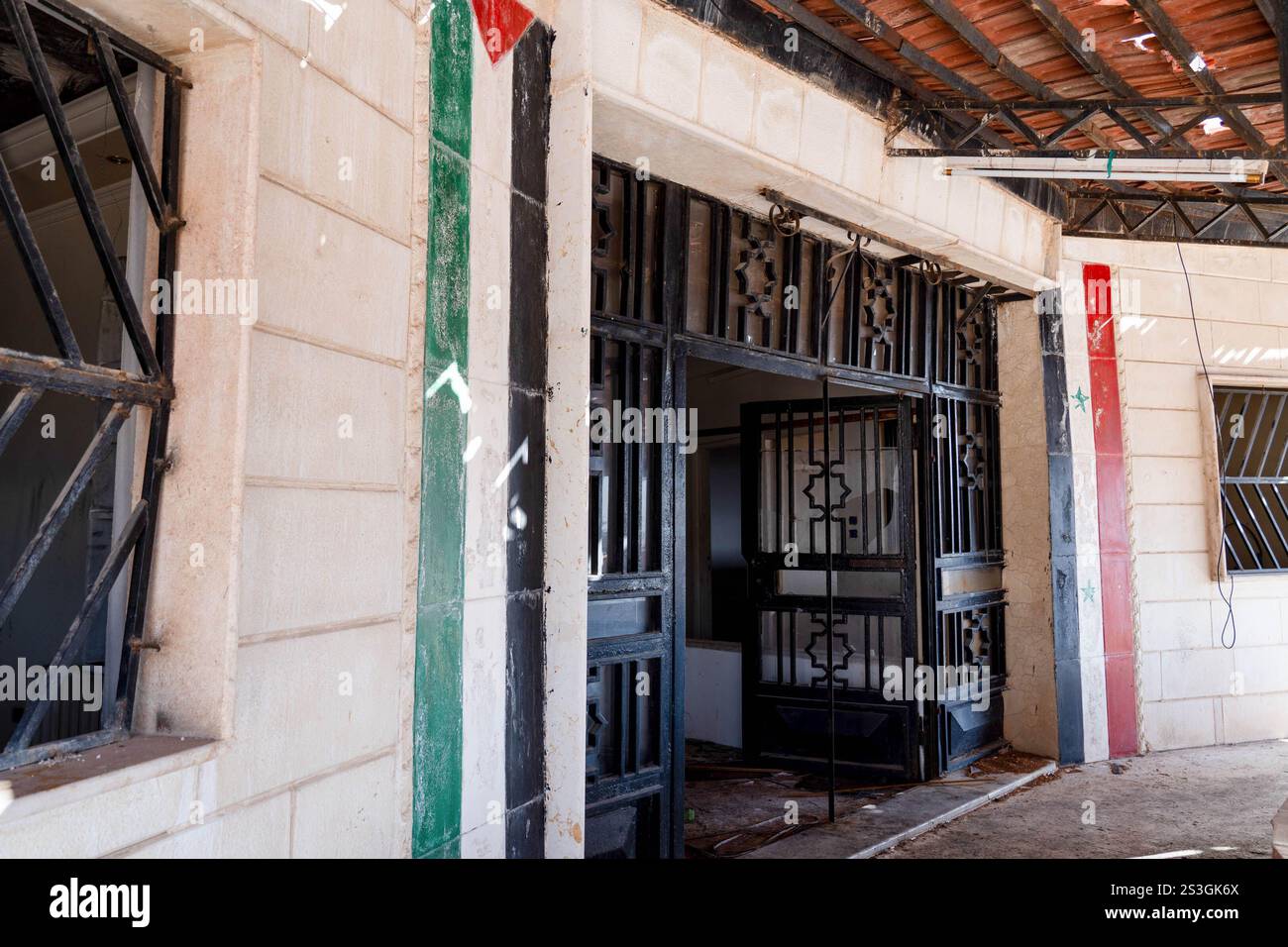 Syria. 07th Jan, 2025. The entrance is painted with the flag of Ba'ath ...